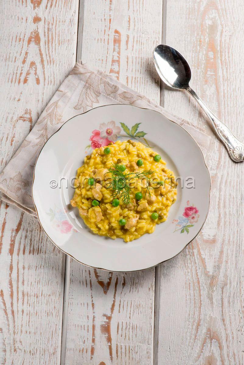 Risotto giallo con lonza e piselli: un primo squisito ed elegante